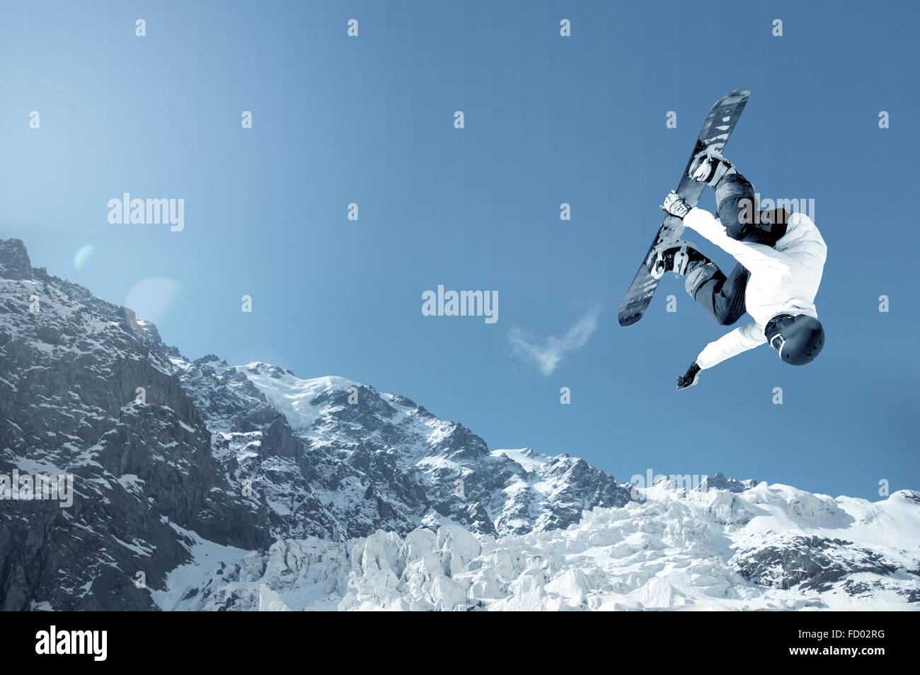 Snowboarder making jump high in clear sky Stock Photo - Alamy