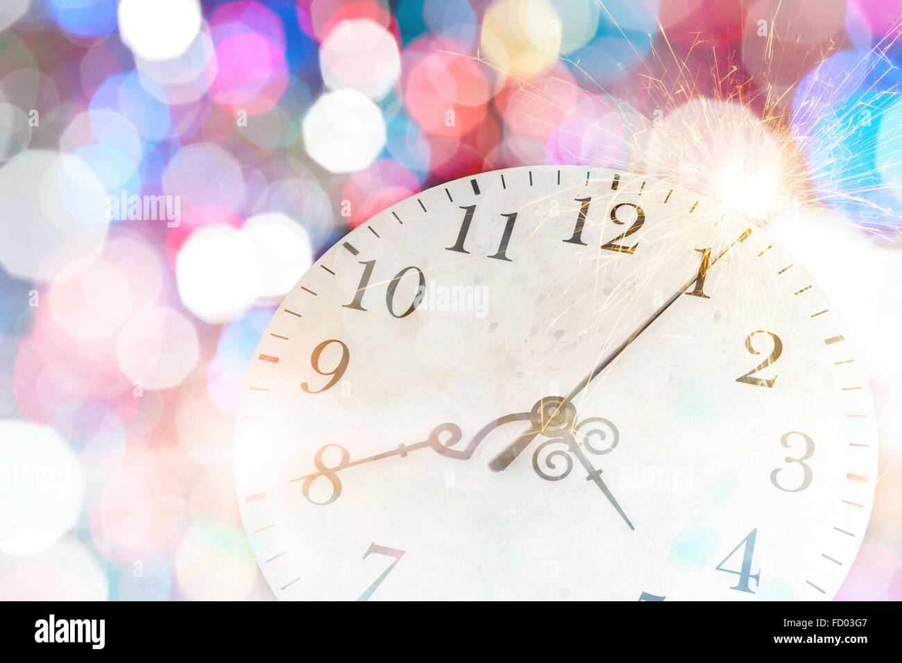 Conceptual image of clock with bokeh lights and firework Stock Photo ...