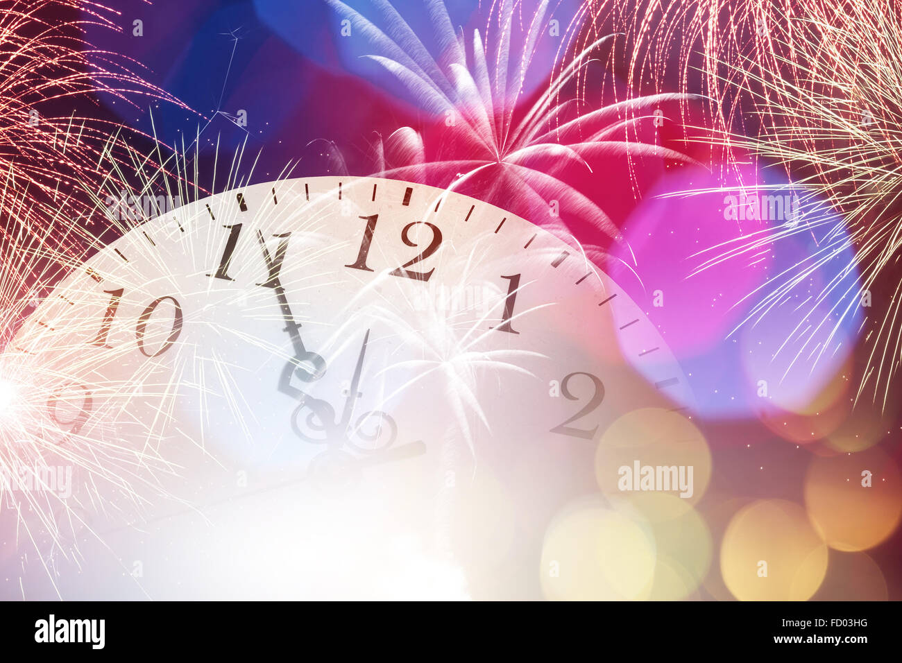 Conceptual image of clock with bokeh lights and firework Stock Photo ...
