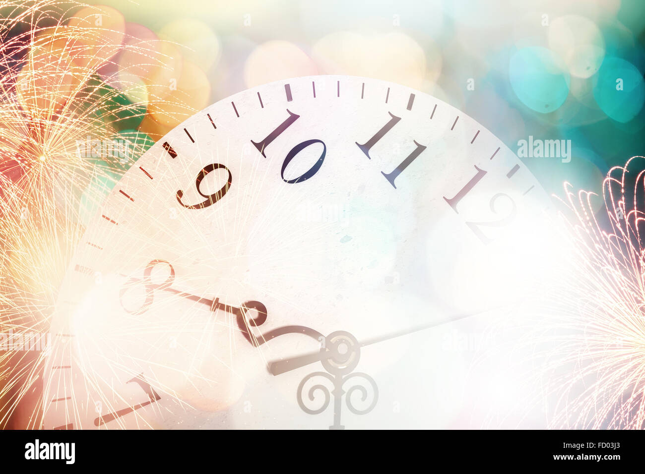 Conceptual image of clock with bokeh lights and firework Stock Photo ...