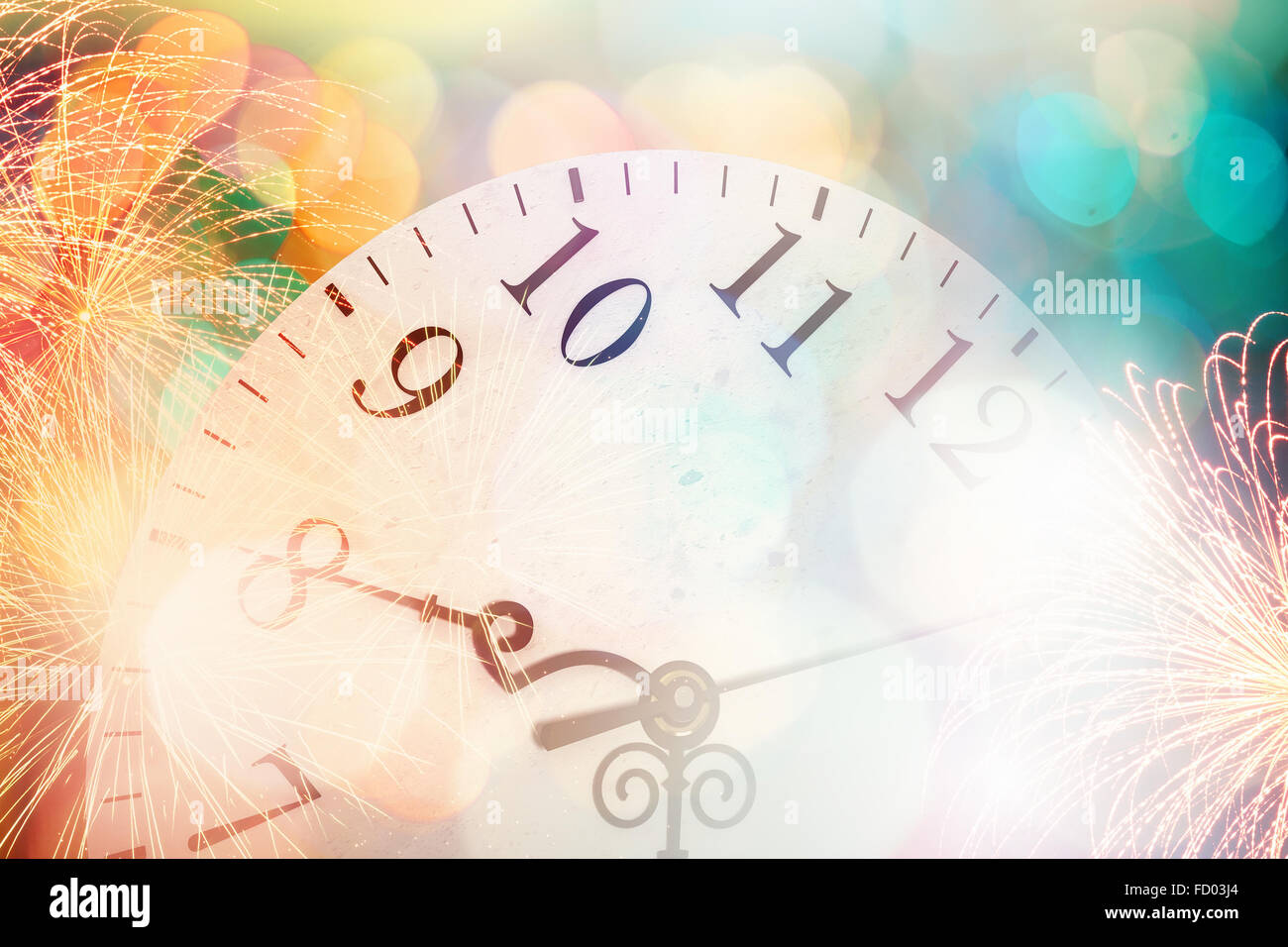 Conceptual image of clock with bokeh lights and firework Stock Photo ...