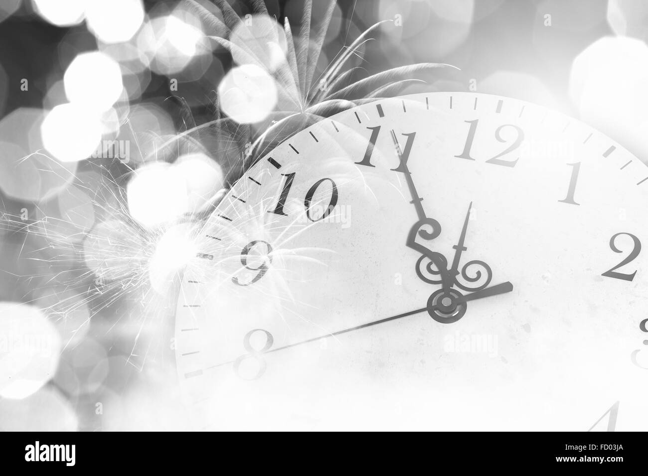 Conceptual image of clock with bokeh lights and firework Stock Photo ...