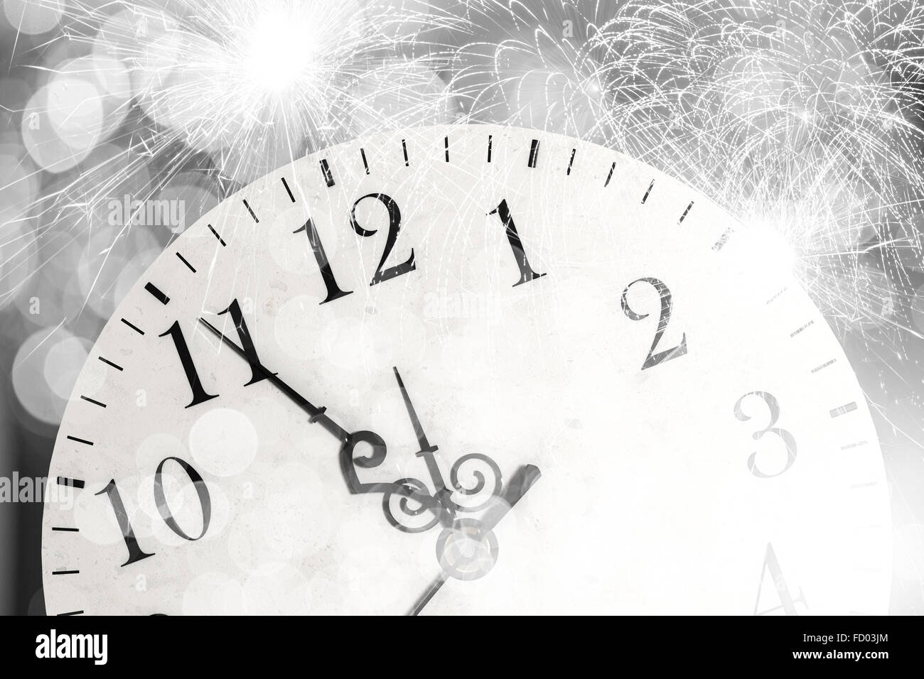 Conceptual image of clock with bokeh lights and firework Stock Photo ...