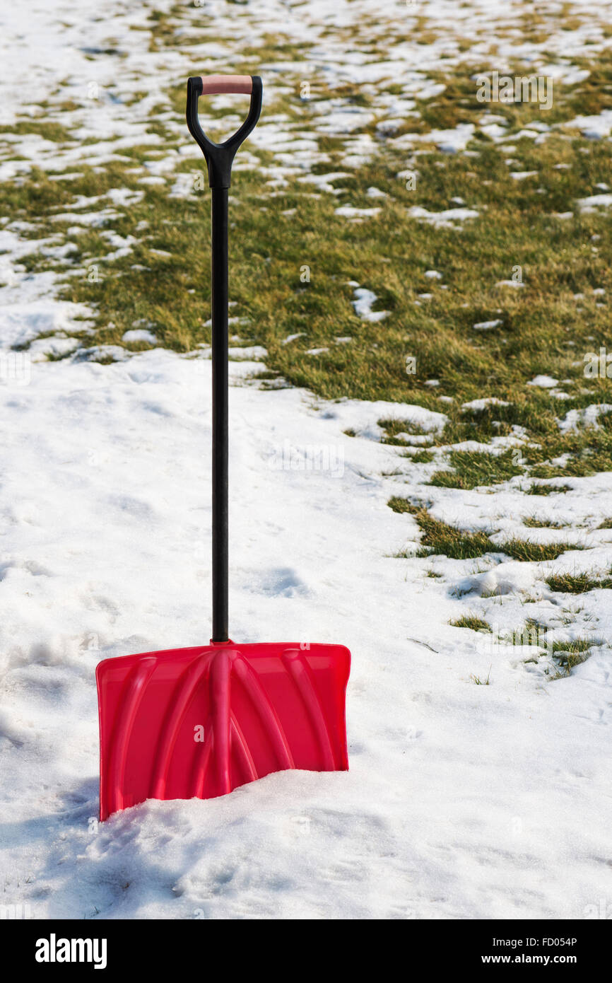 Red plastic shovel for snow removal. Winter is coming Stock Photo - Alamy