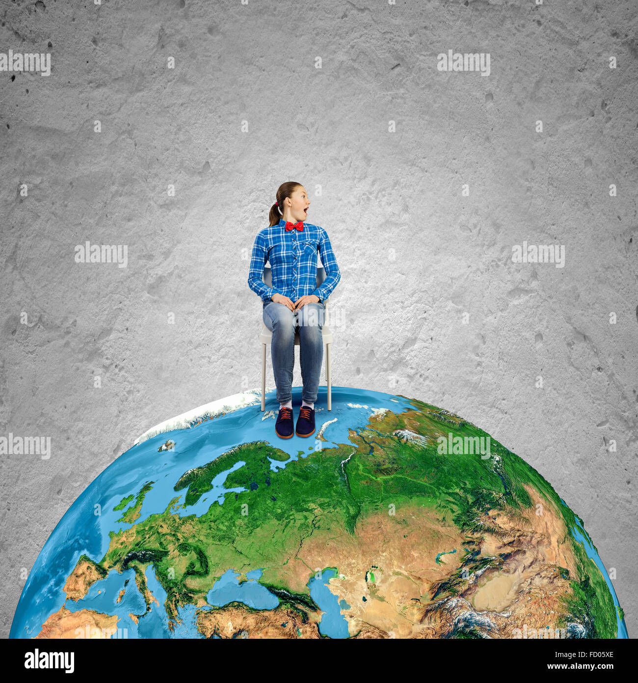 Young girl in shirt sitting on chair on Earth planet. Elements of this ...