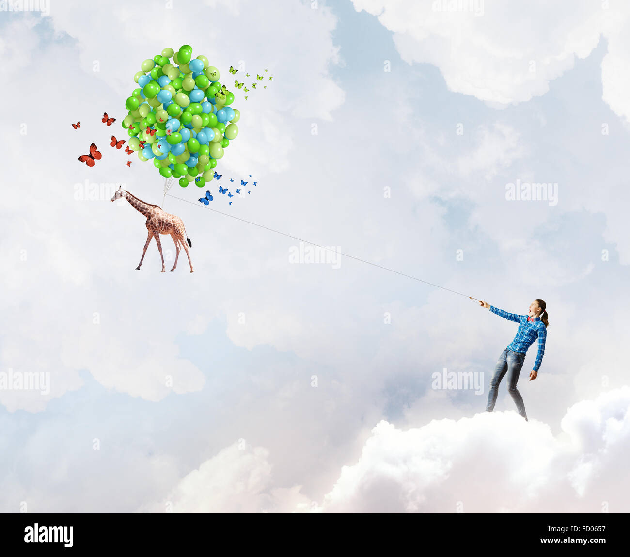 Young woman in casual and giraffe flying in sky Stock Photo - Alamy