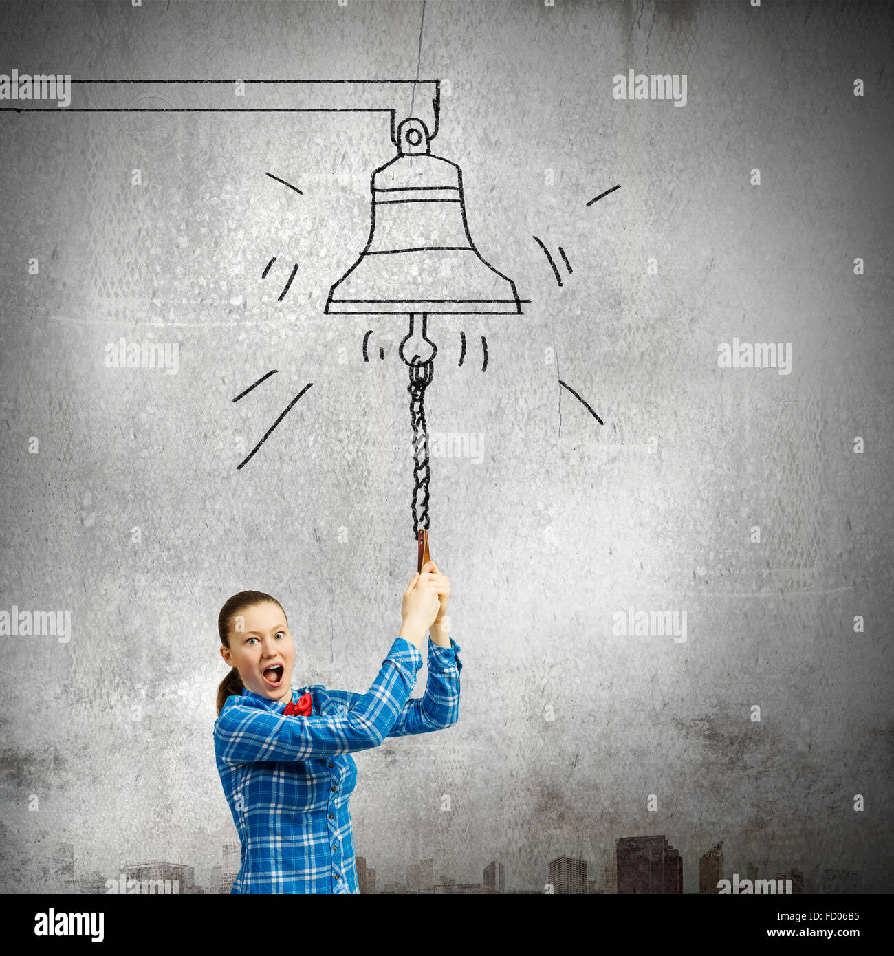Young excited woman in casual ringing bell Stock Photo - Alamy