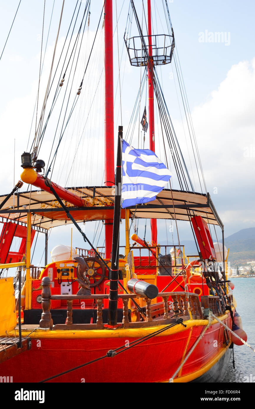Old sailing ship with Greek flag Stock Photo - Alamy