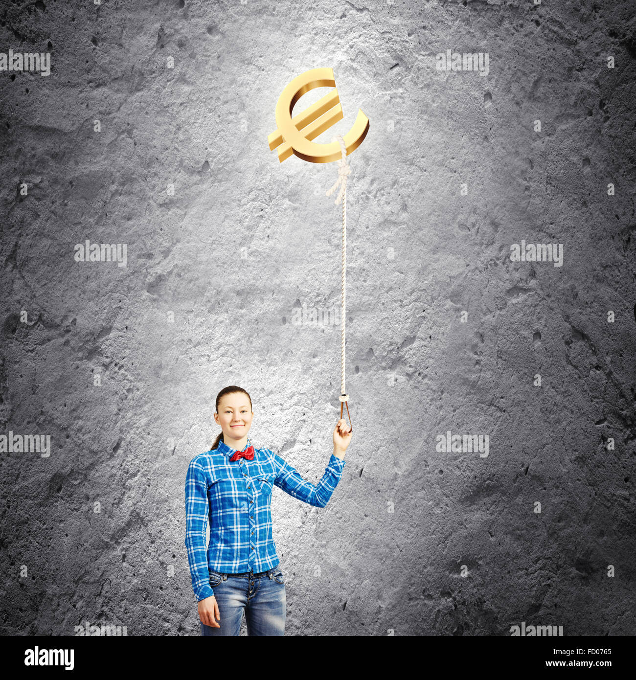 Young woman holding balloon shaped like euro sign Stock Photo - Alamy