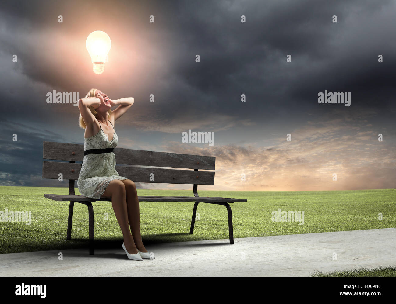 Young woman sitting on bench closing ears with palms and screaming ...
