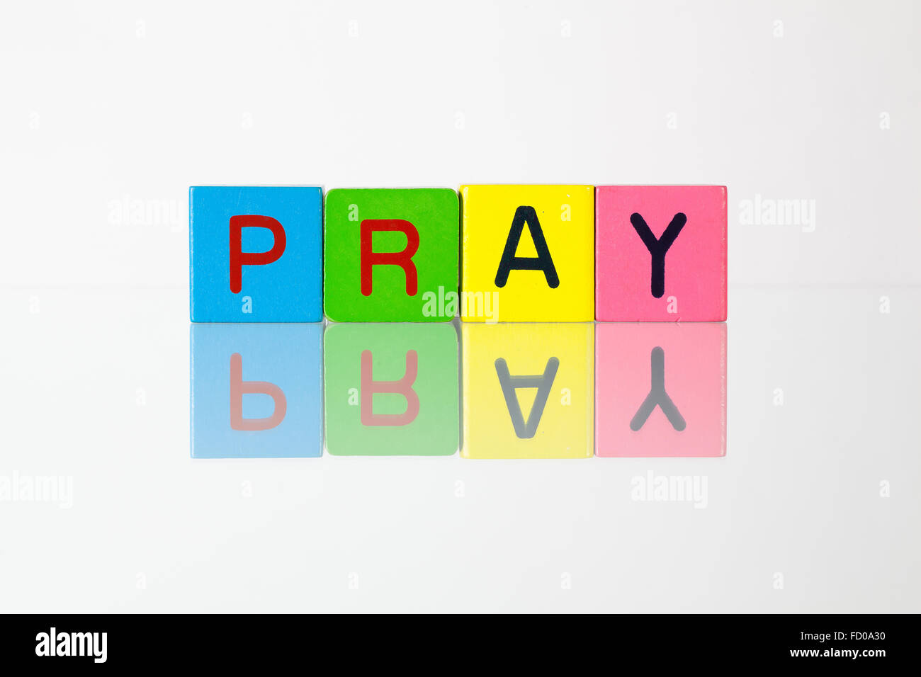 Pray - an inscription from children's wooden blocks Stock Photo - Alamy