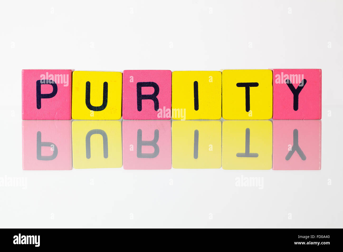 Purity - an inscription from children's wooden blocks Stock Photo - Alamy