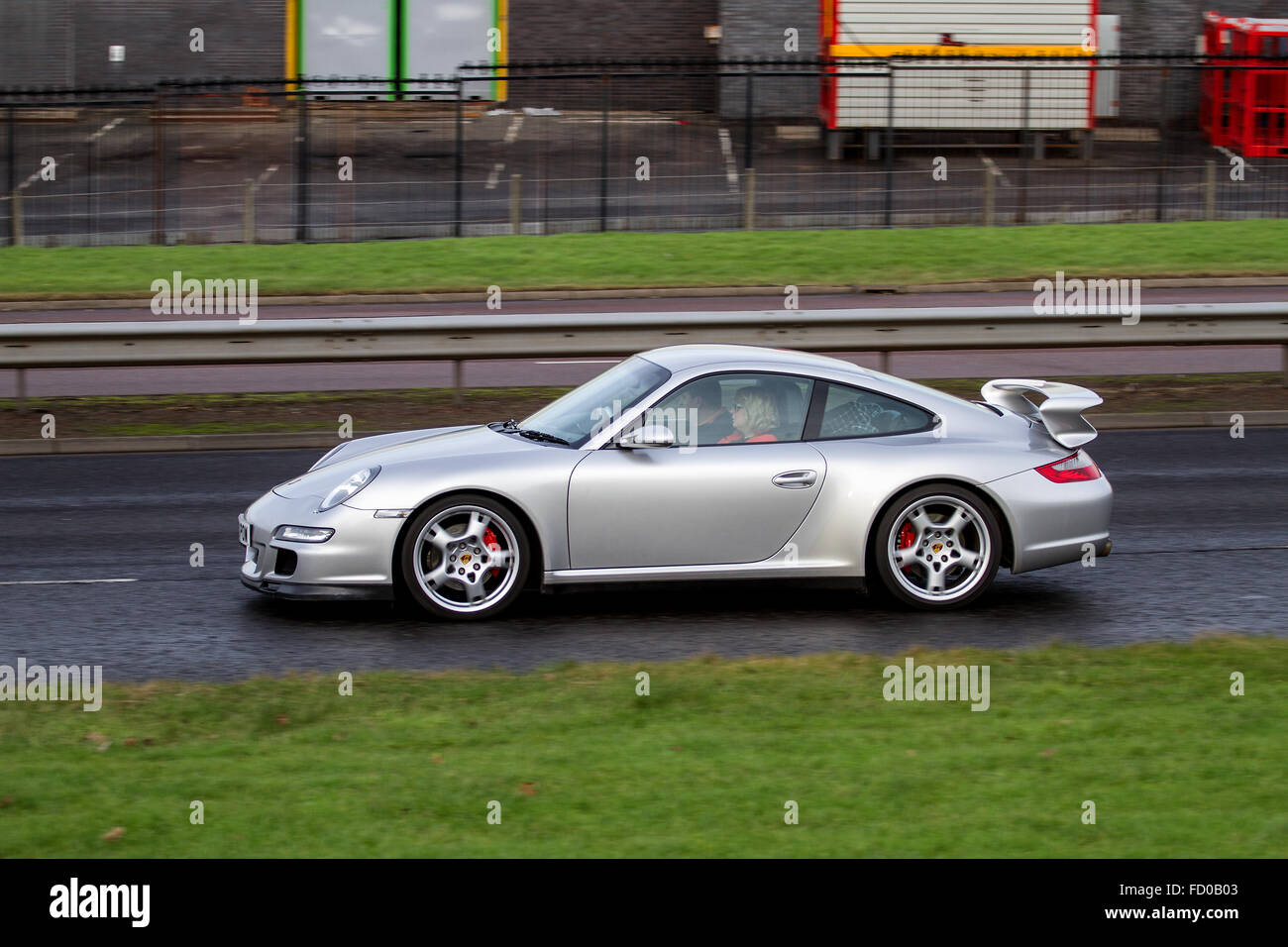 A silver Porsche 911 GT3 sports car travelling along the Kingsway West ...