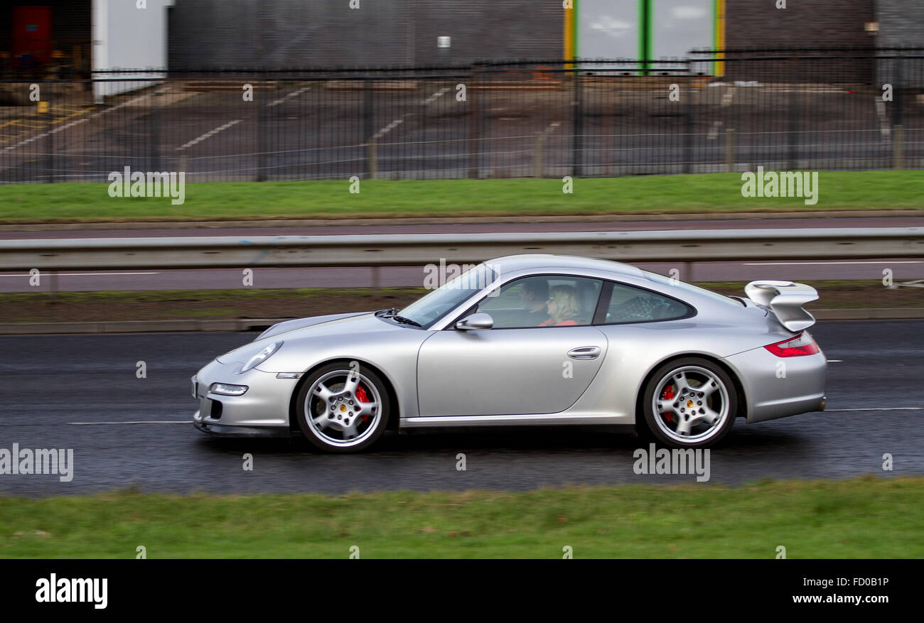 A silver Porsche 911 GT3 sports car travelling along the Kingsway West ...
