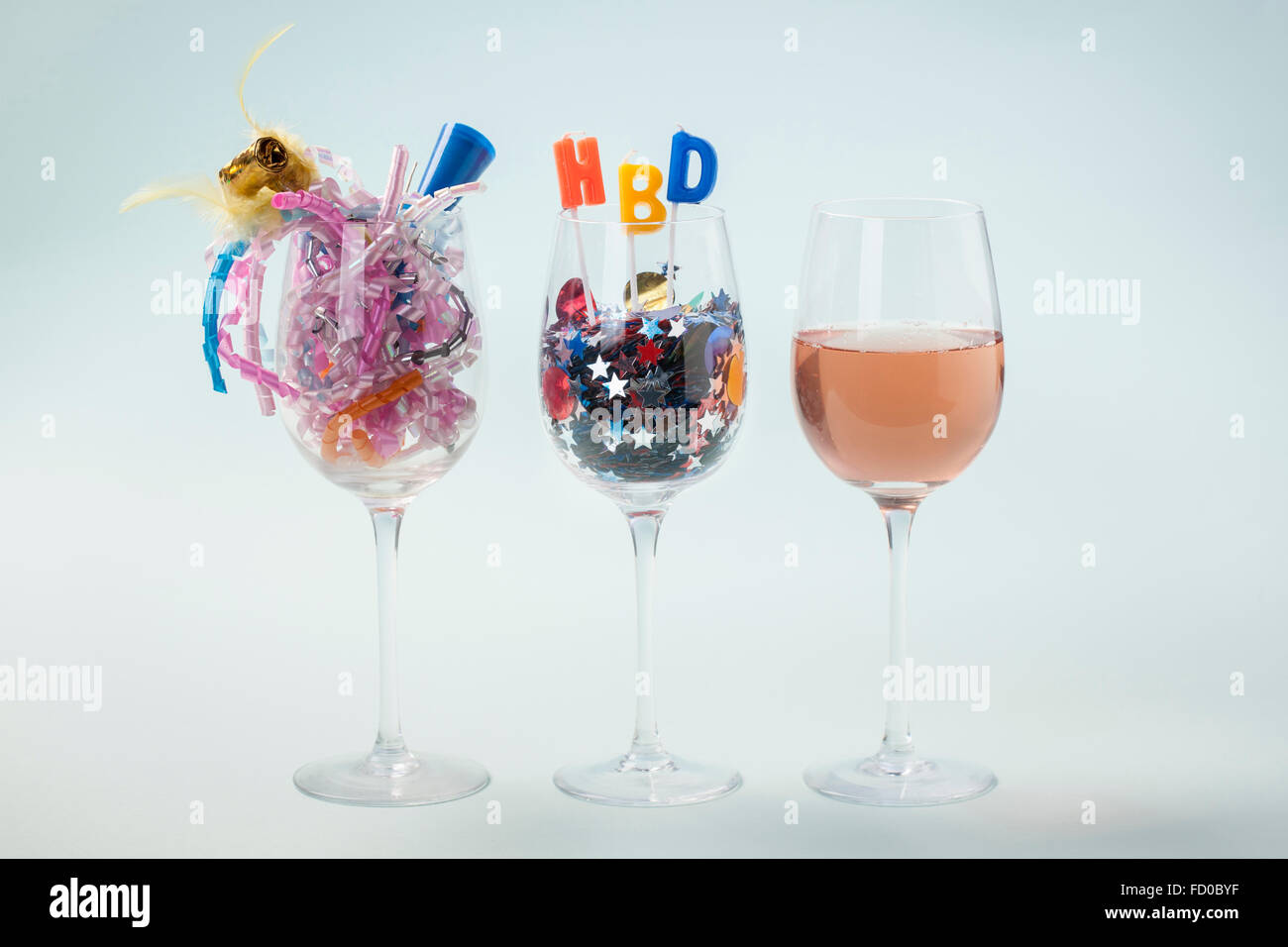 Three Wine Glasses Filled With Different Things Representing Birthday Party Or Anniversary