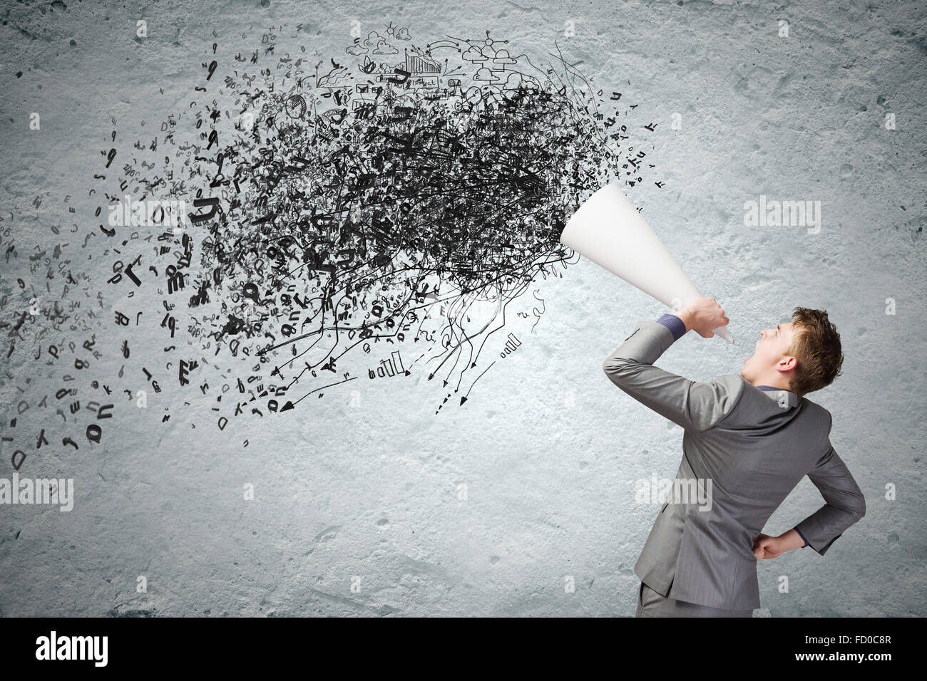 Young excited businessman screaming in paper trumpet Stock Photo - Alamy