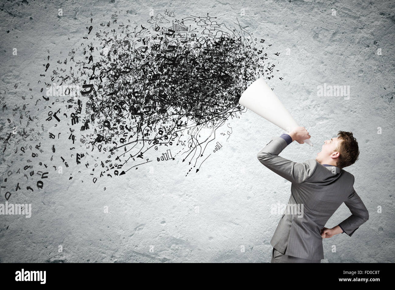 Young excited businessman screaming in paper trumpet Stock Photo - Alamy