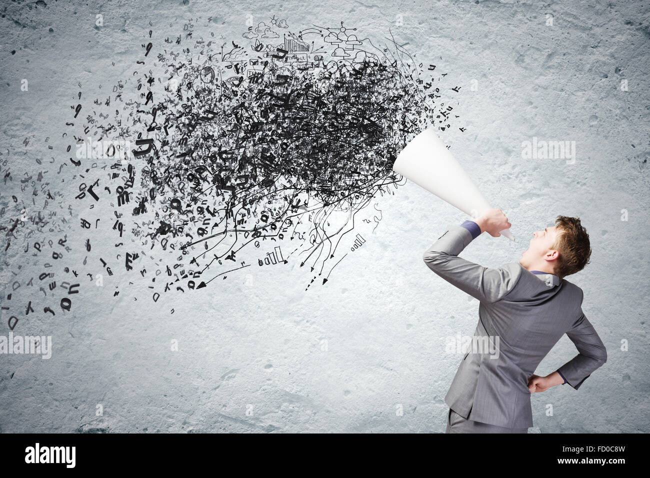 Young excited businessman screaming in paper trumpet Stock Photo - Alamy
