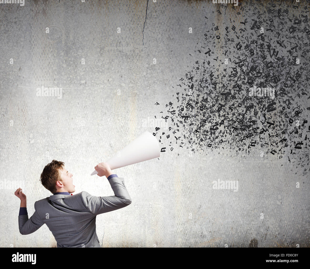 Young excited businessman screaming in paper trumpet Stock Photo - Alamy