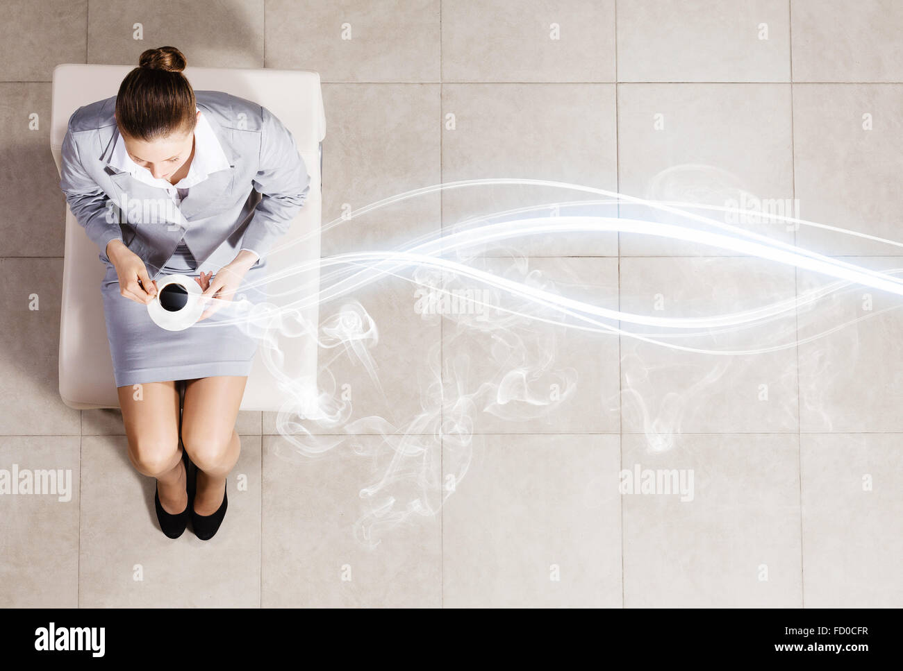 Top view of busineswoman sitting on chair with cup of coffee Stock ...