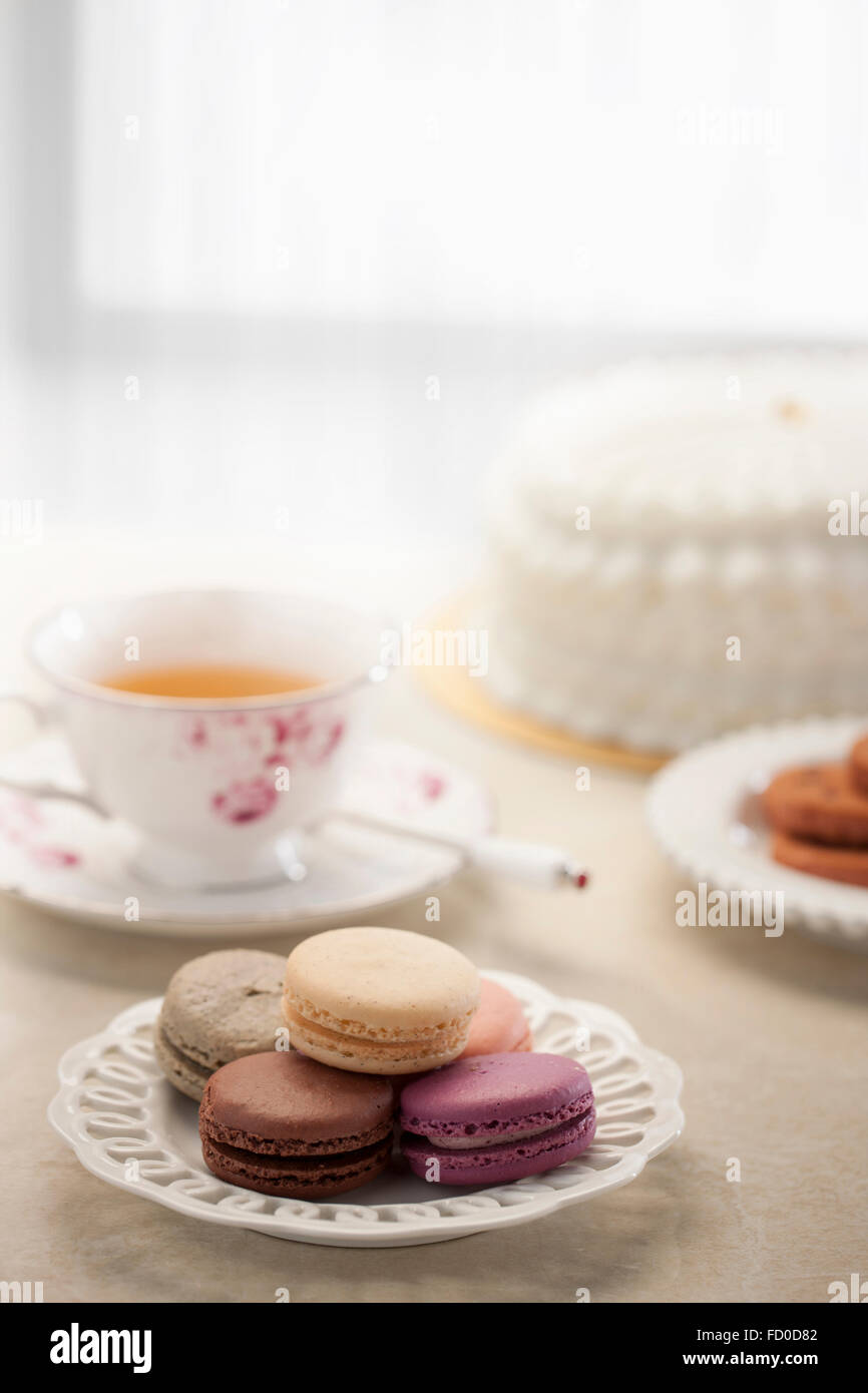 Macaroons on a plate out of focus Stock Photo - Alamy
