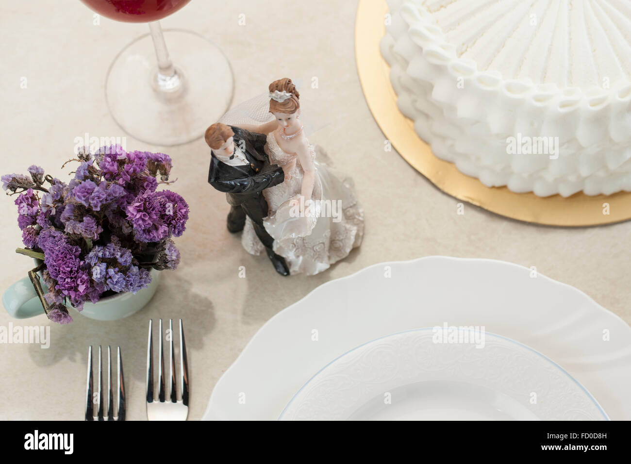 High angle of miniature bride and groom figure on table Stock Photo - Alamy