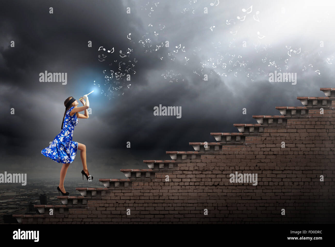 Young woman in blue dress playing fife and stepping the ladder Stock ...