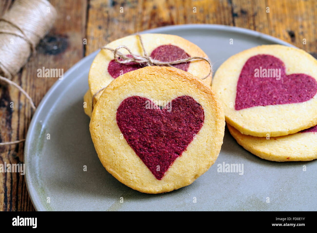 Valentine biscuits with raspberry hearts Stock Photo - Alamy