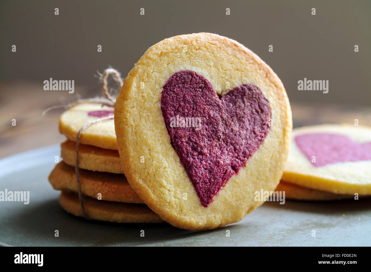 Valentine biscuits with raspberry hearts Stock Photo - Alamy