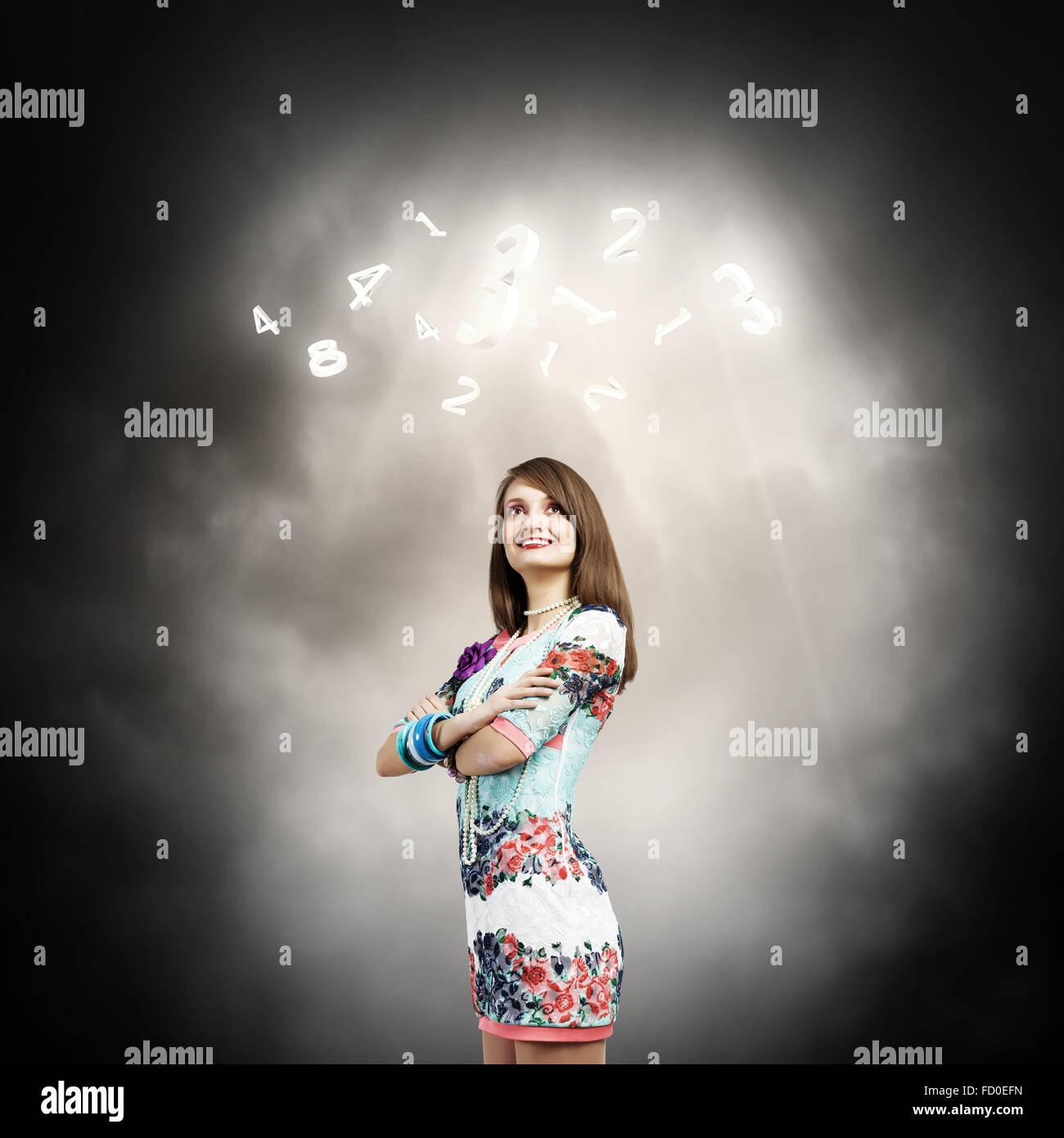 Young pretty woman standing under sun lights Stock Photo - Alamy