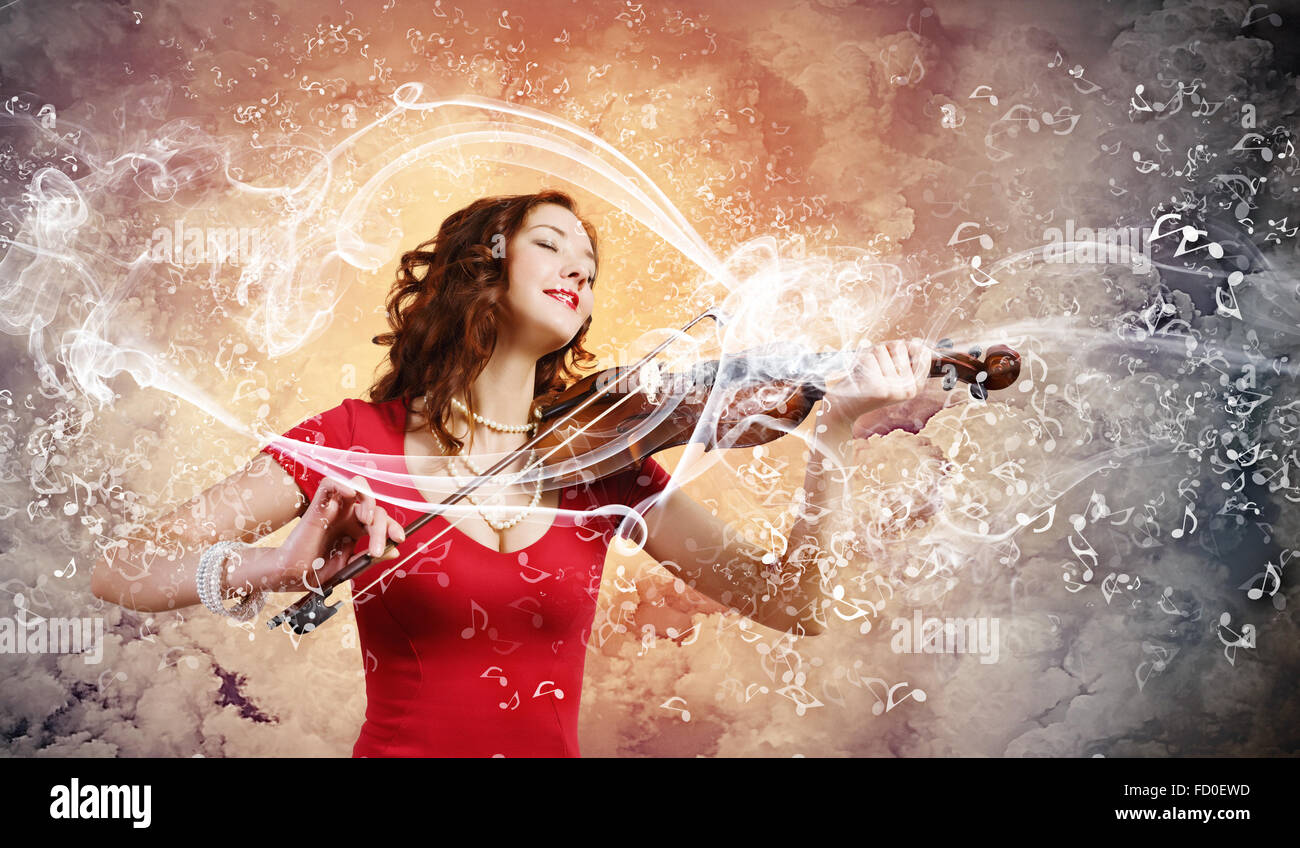 Young attractive woman in red dress playing violin Stock Photo - Alamy