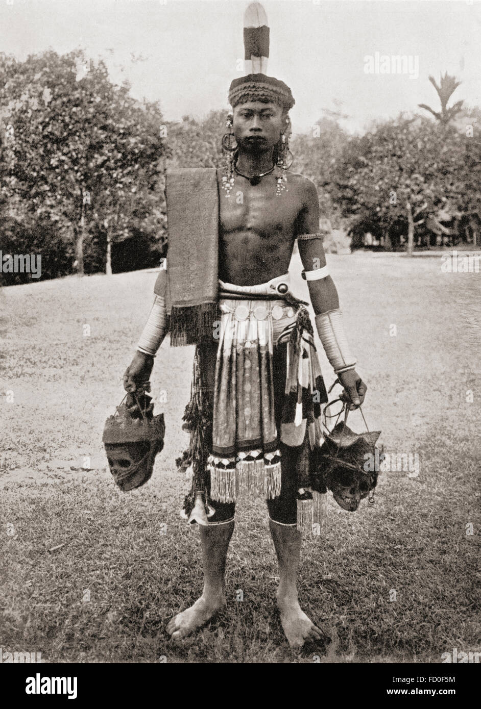 A Dayak, Dyak or Dayuh man from the island of Borneo, seen here in gala ...