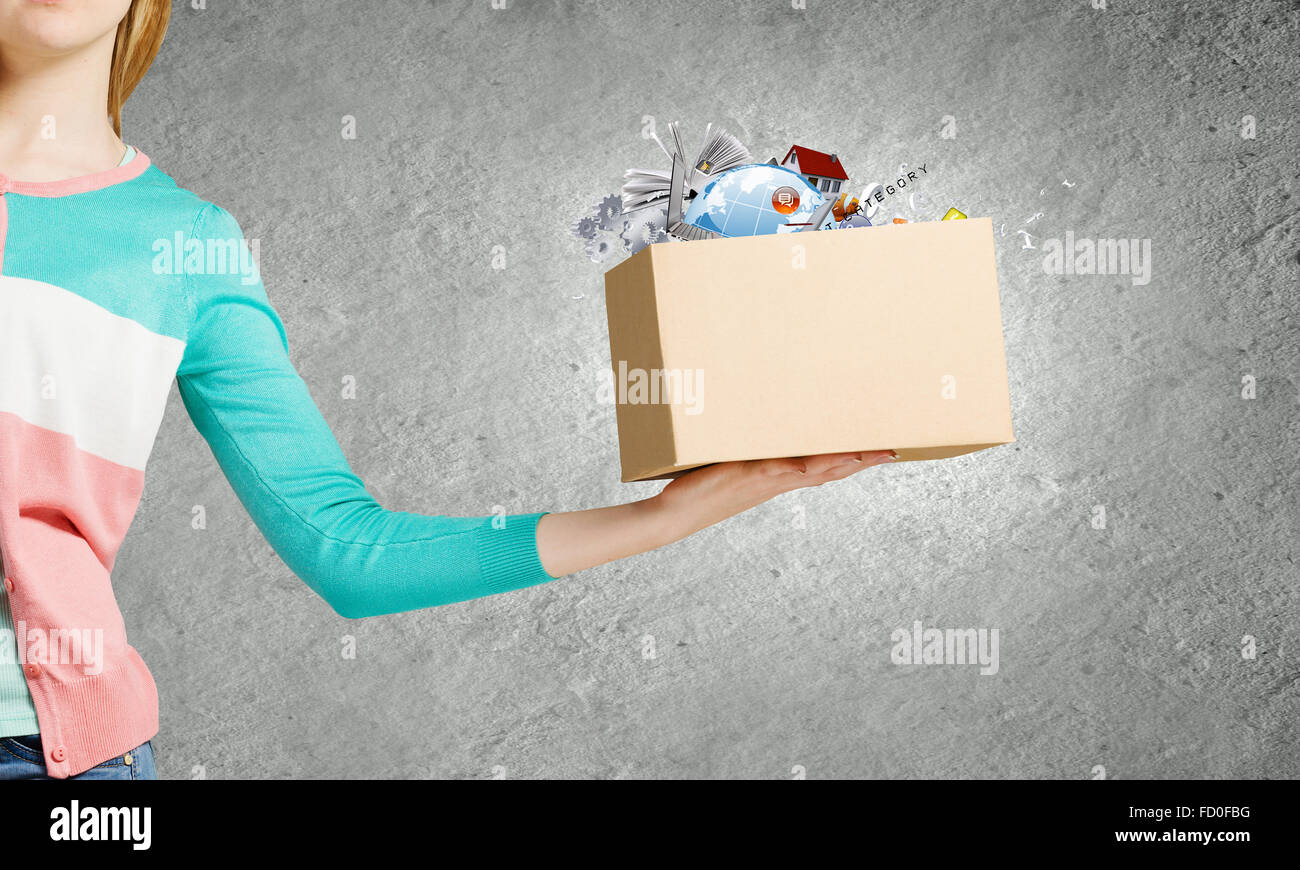 Close up of female hand holding carton box with colorful splashes Stock ...