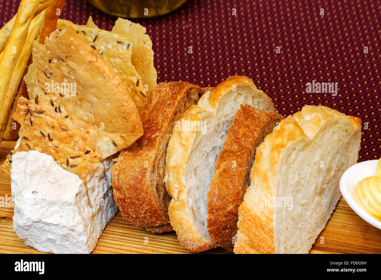 Assortment of baked bread over brown background Stock Photo - Alamy