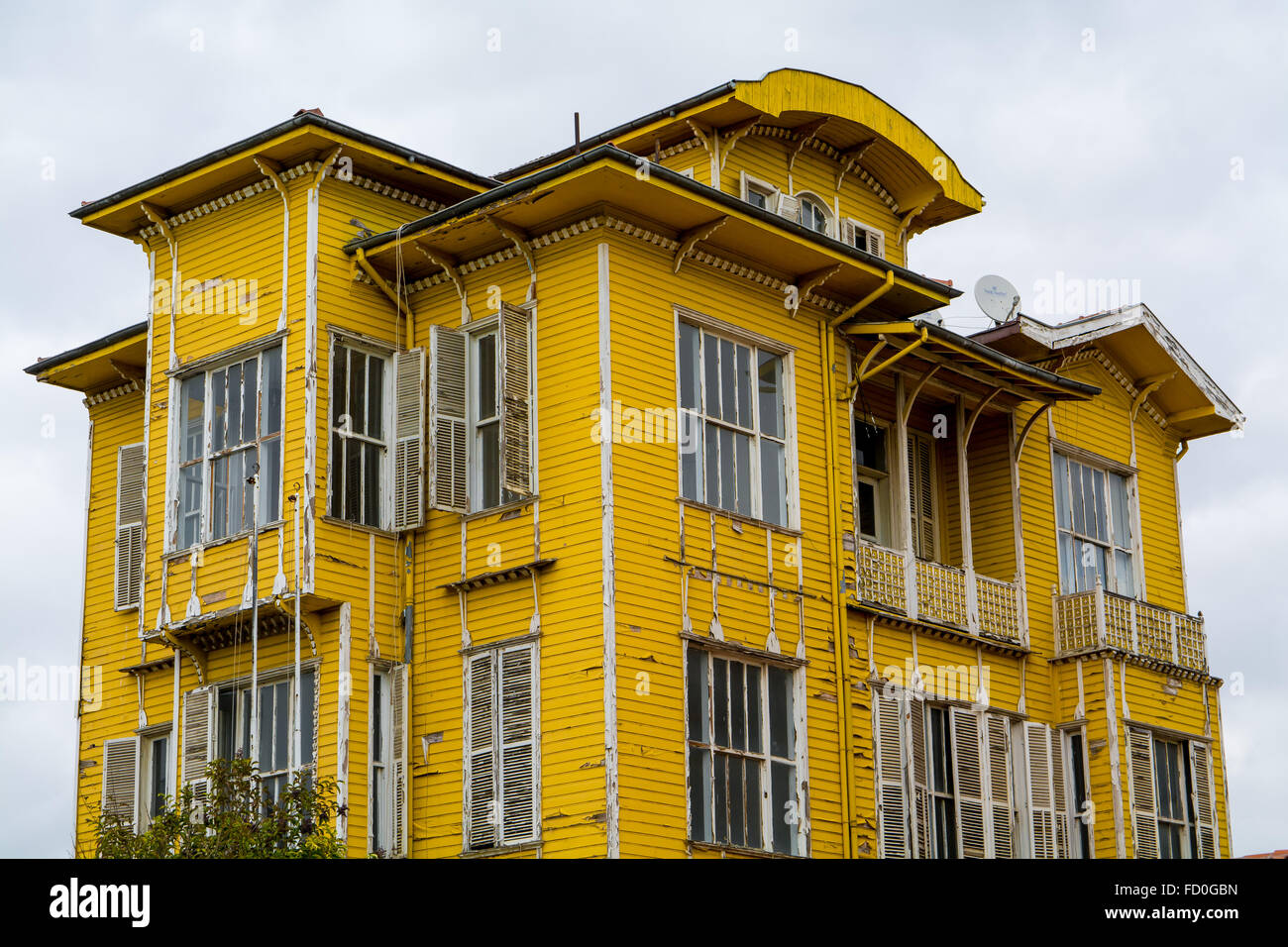 View of Old Colonial Wooden Yellow Old House Against Clouds and Sky ...