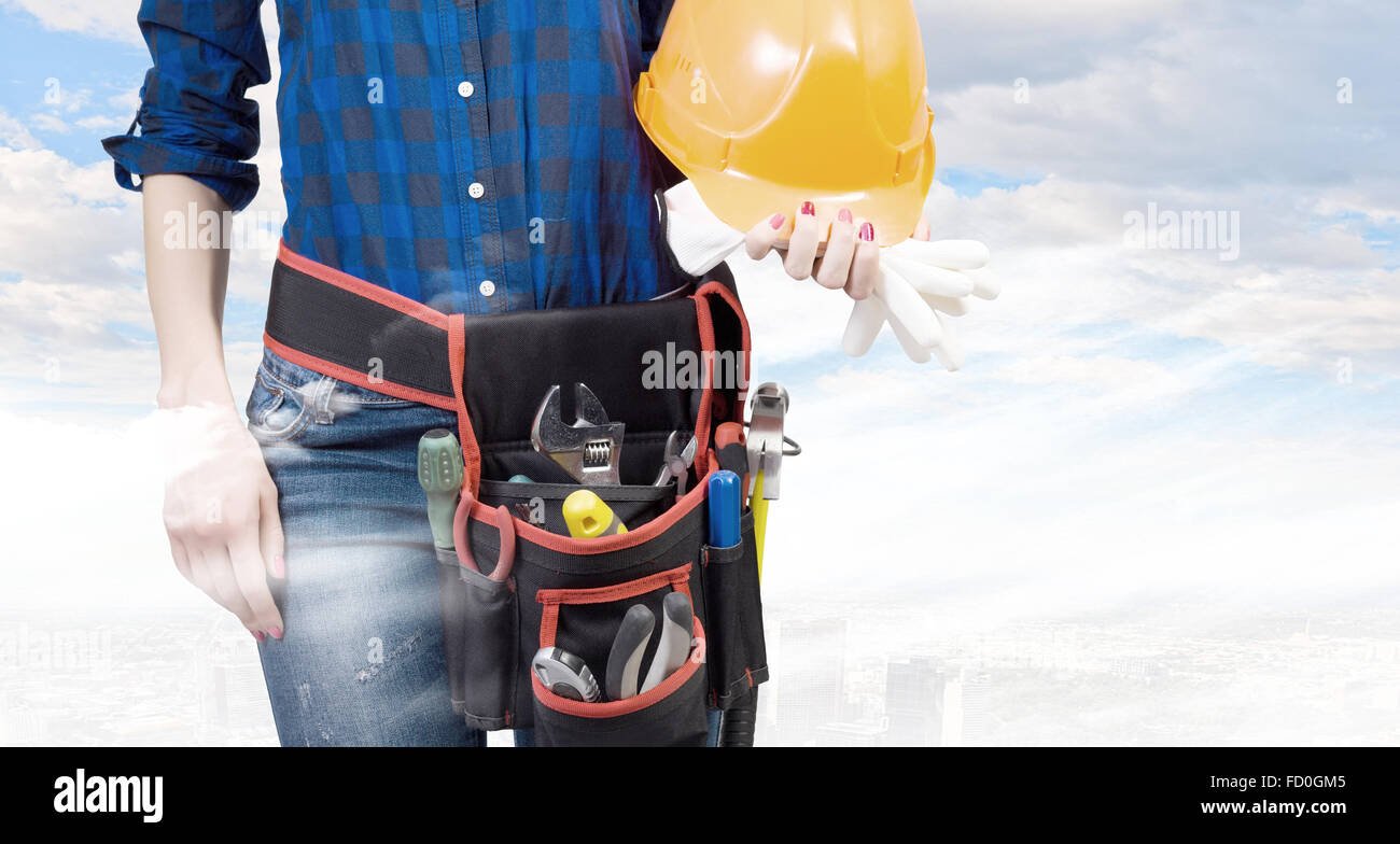 Bottom view of woman engineer with tool belt on waist Stock Photo - Alamy