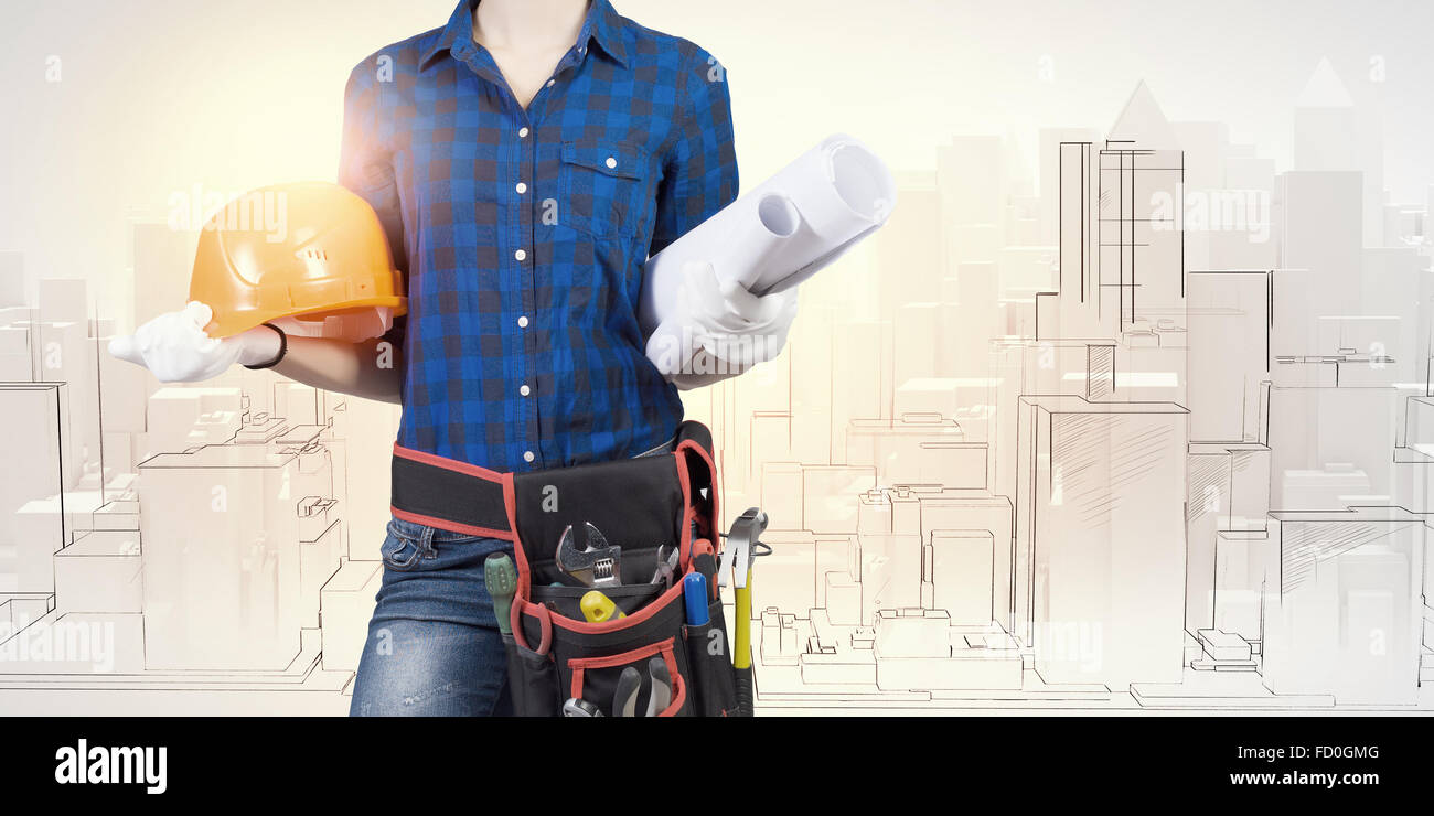 Bottom view of woman engineer with tool belt on waist Stock Photo - Alamy