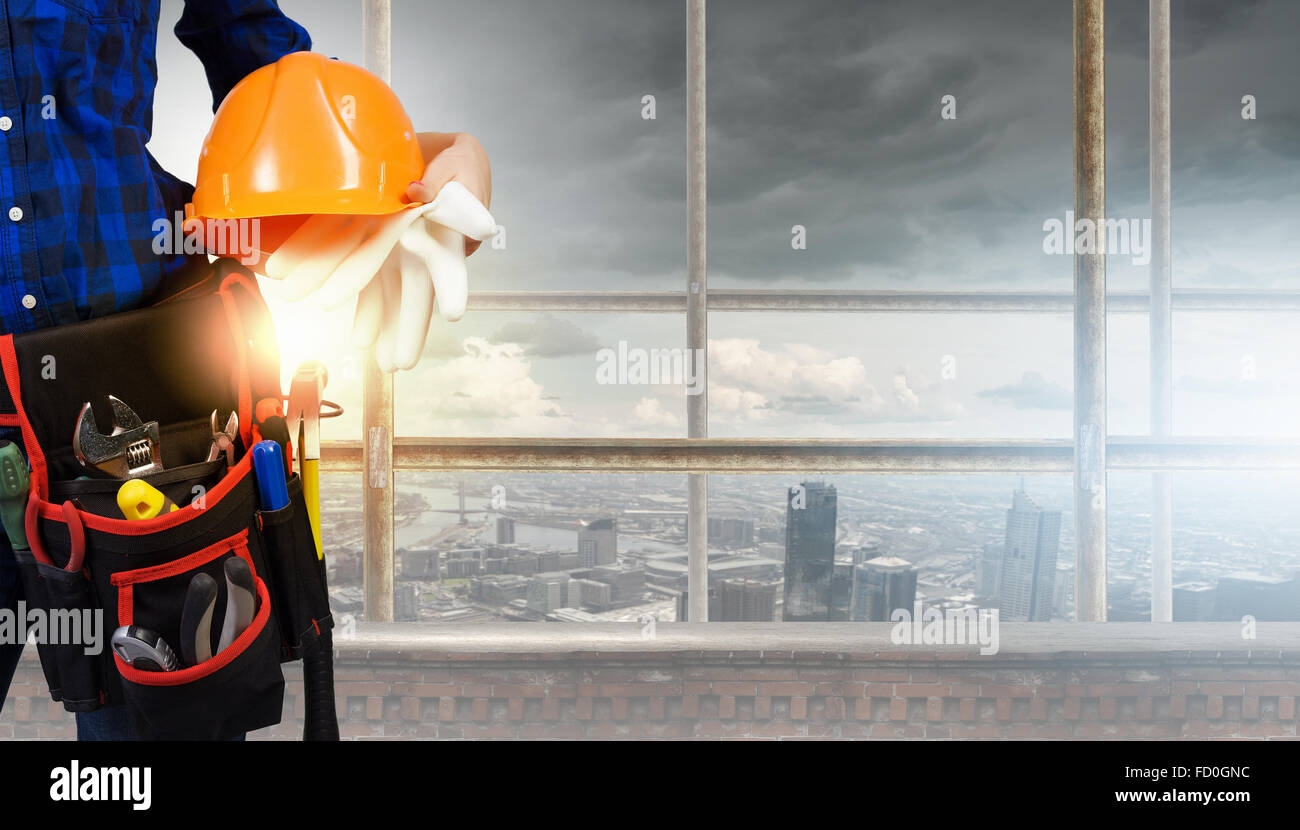 Bottom view of woman engineer with tool belt on waist Stock Photo - Alamy