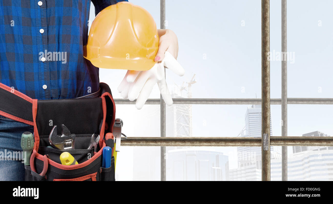 Bottom view of woman engineer with tool belt on waist Stock Photo - Alamy