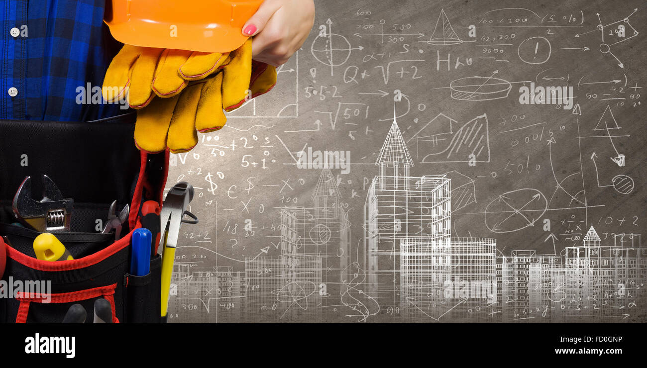 Bottom view of woman engineer with tool belt on waist Stock Photo - Alamy