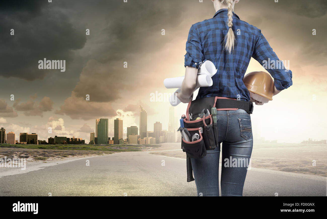 Bottom view of woman engineer with tool belt on waist Stock Photo - Alamy