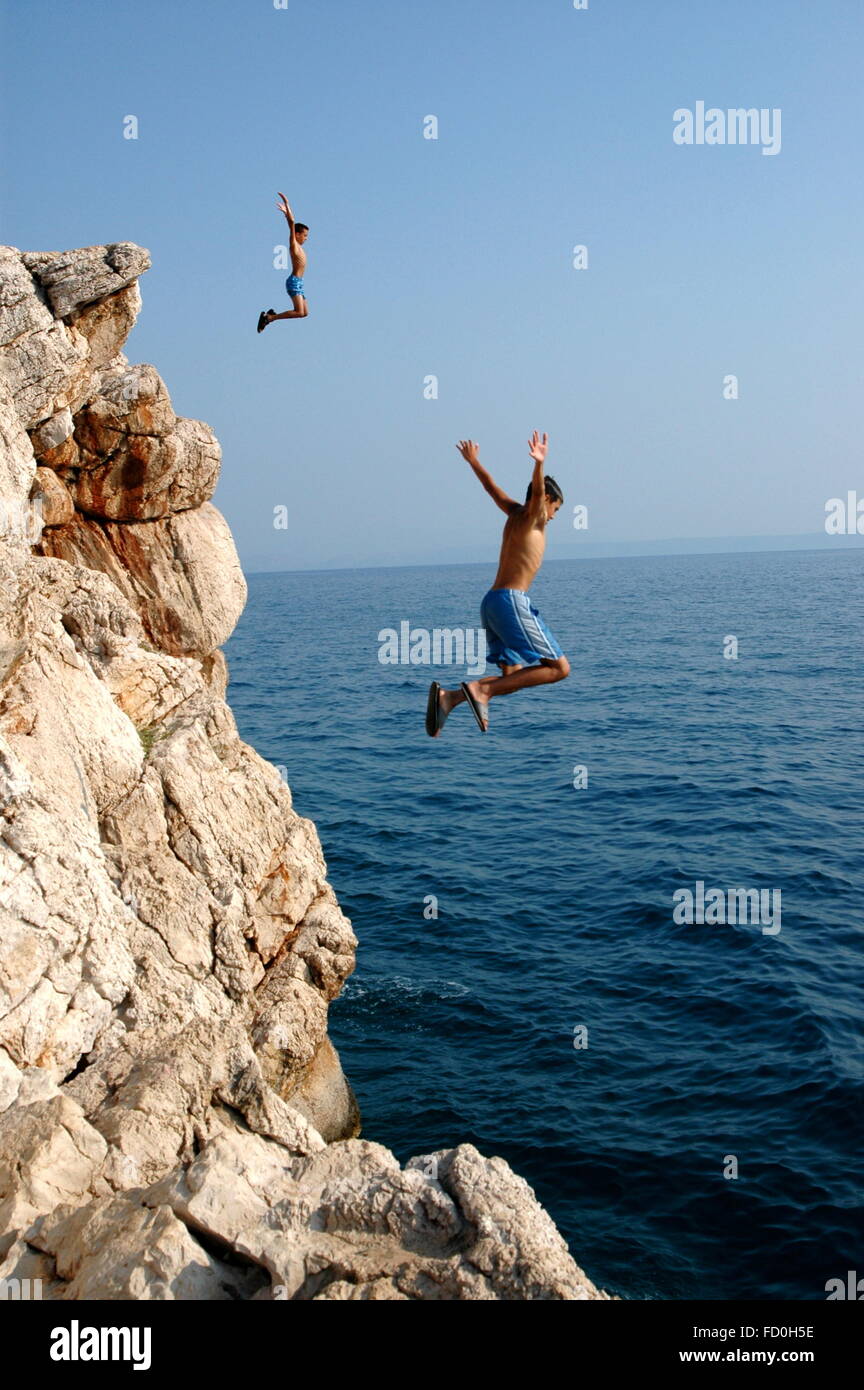 Kids jumping from the cliffs - Makarska, Osejava peninsula, Dalmatia ...