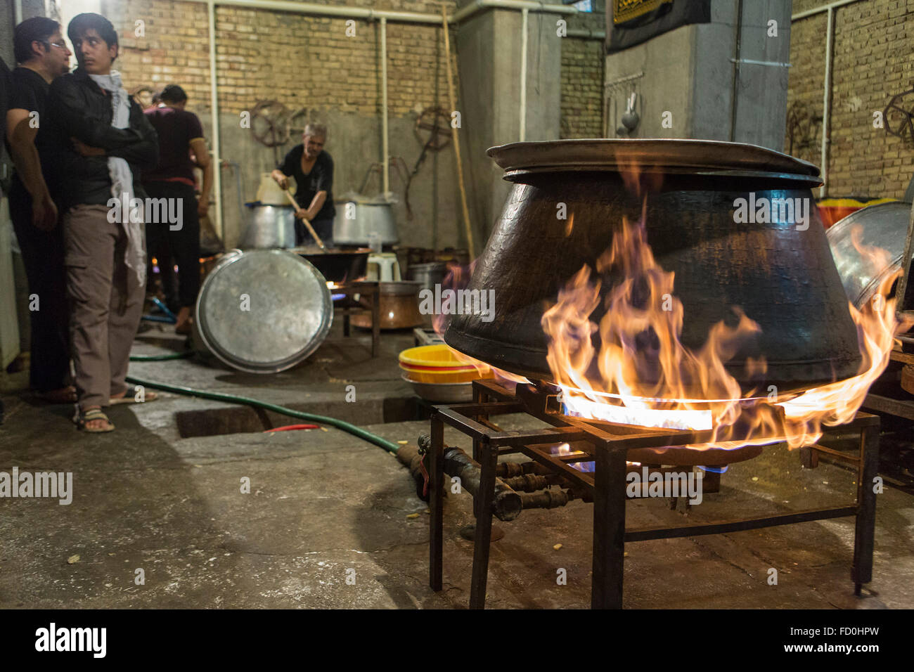 Preparing food for Nazri in Ashura ritual in Kashan, Iran Stock Photo ...