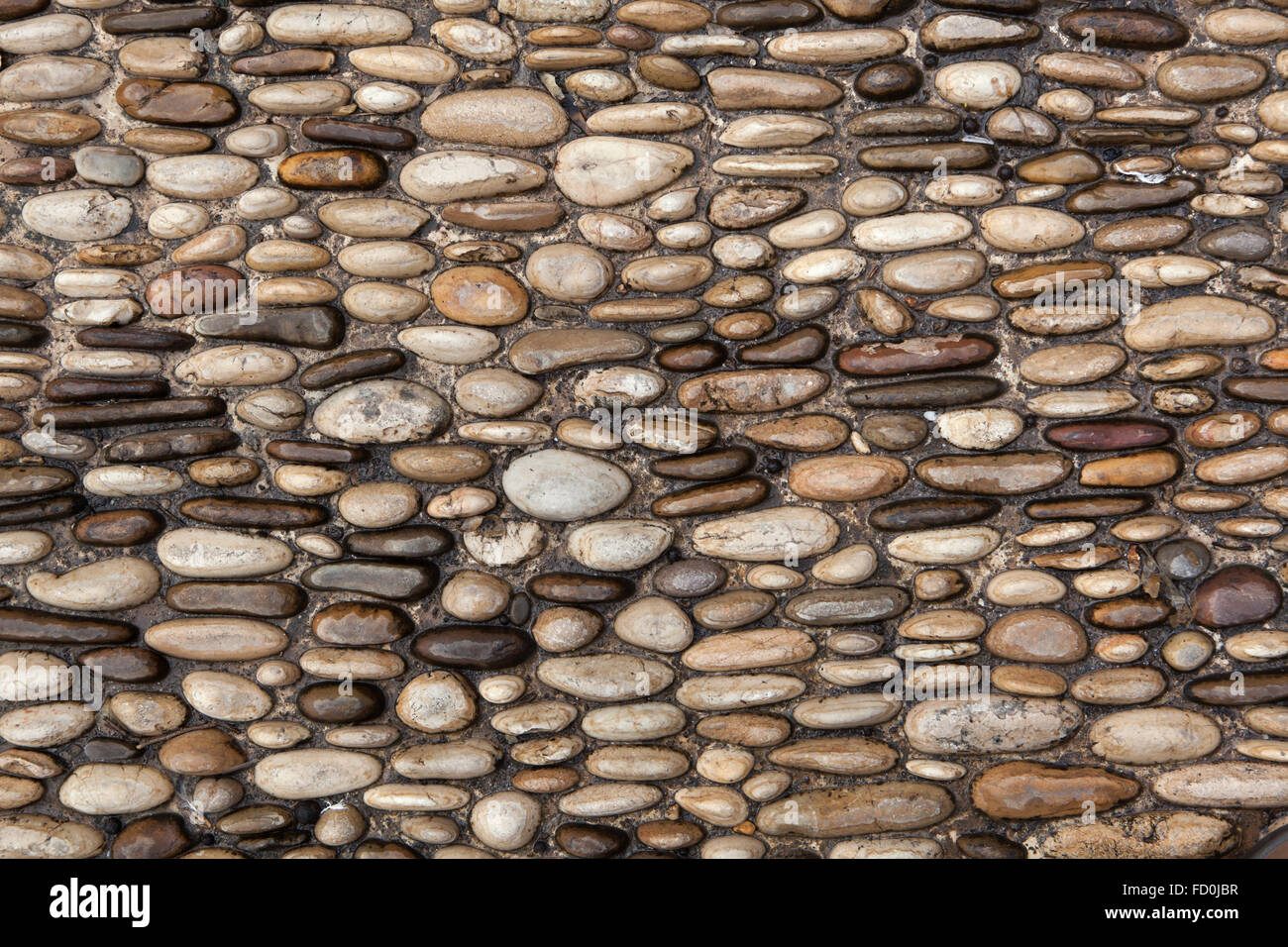 Cobbled pavement made of river rounded pebbles in Cordoba, Andalusia ...