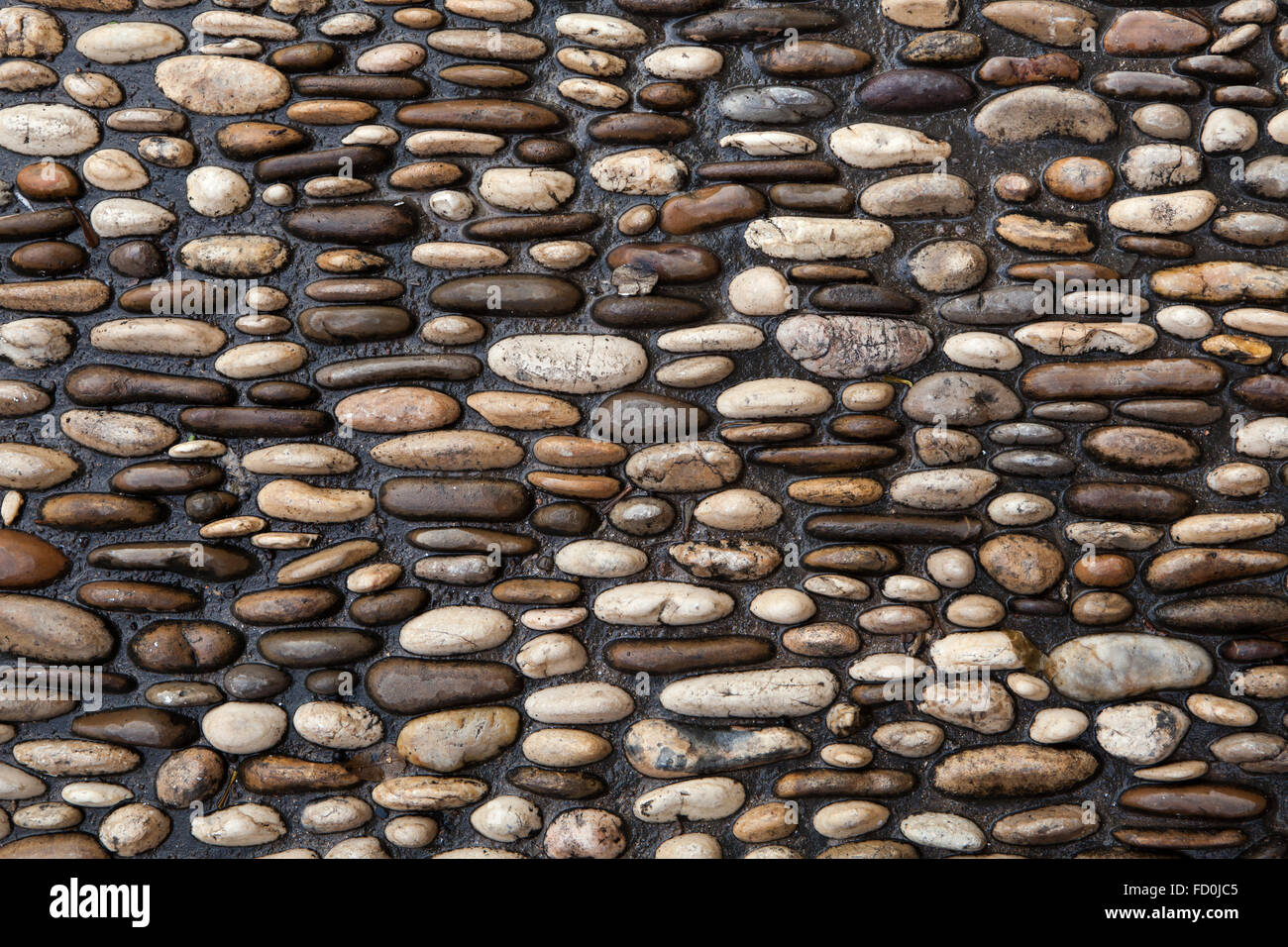 Cobbled pavement made of river rounded pebbles in Cordoba, Andalusia ...