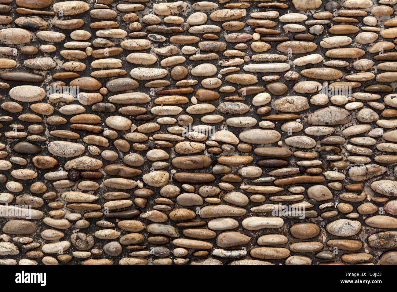 Cobbled pavement made of river rounded pebbles in Cordoba, Andalusia ...
