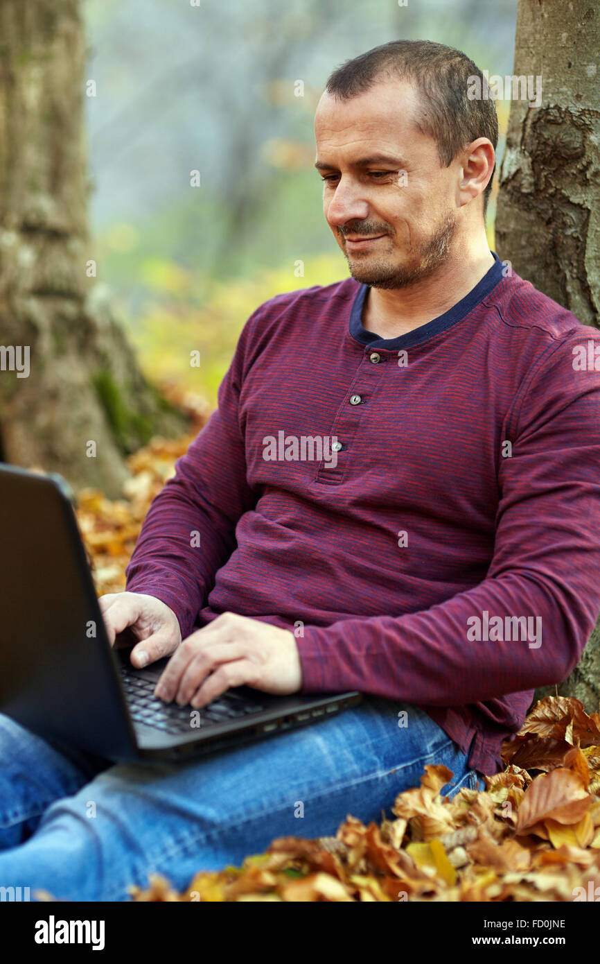 Businessman in forest hi-res stock photography and images - Alamy