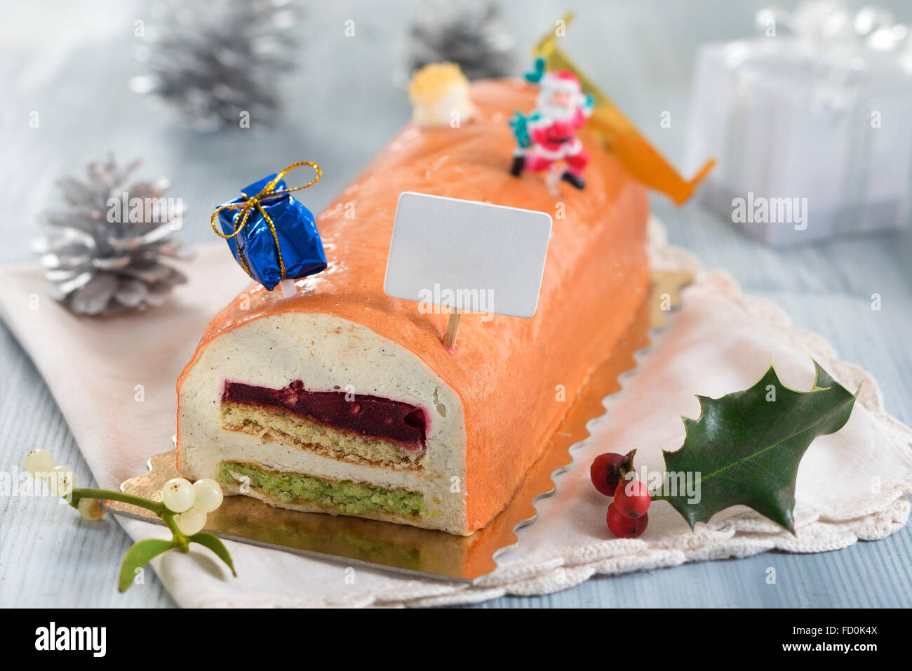 Yule log of white chocolate mousse, stuffed with raspberry puree Stock ...