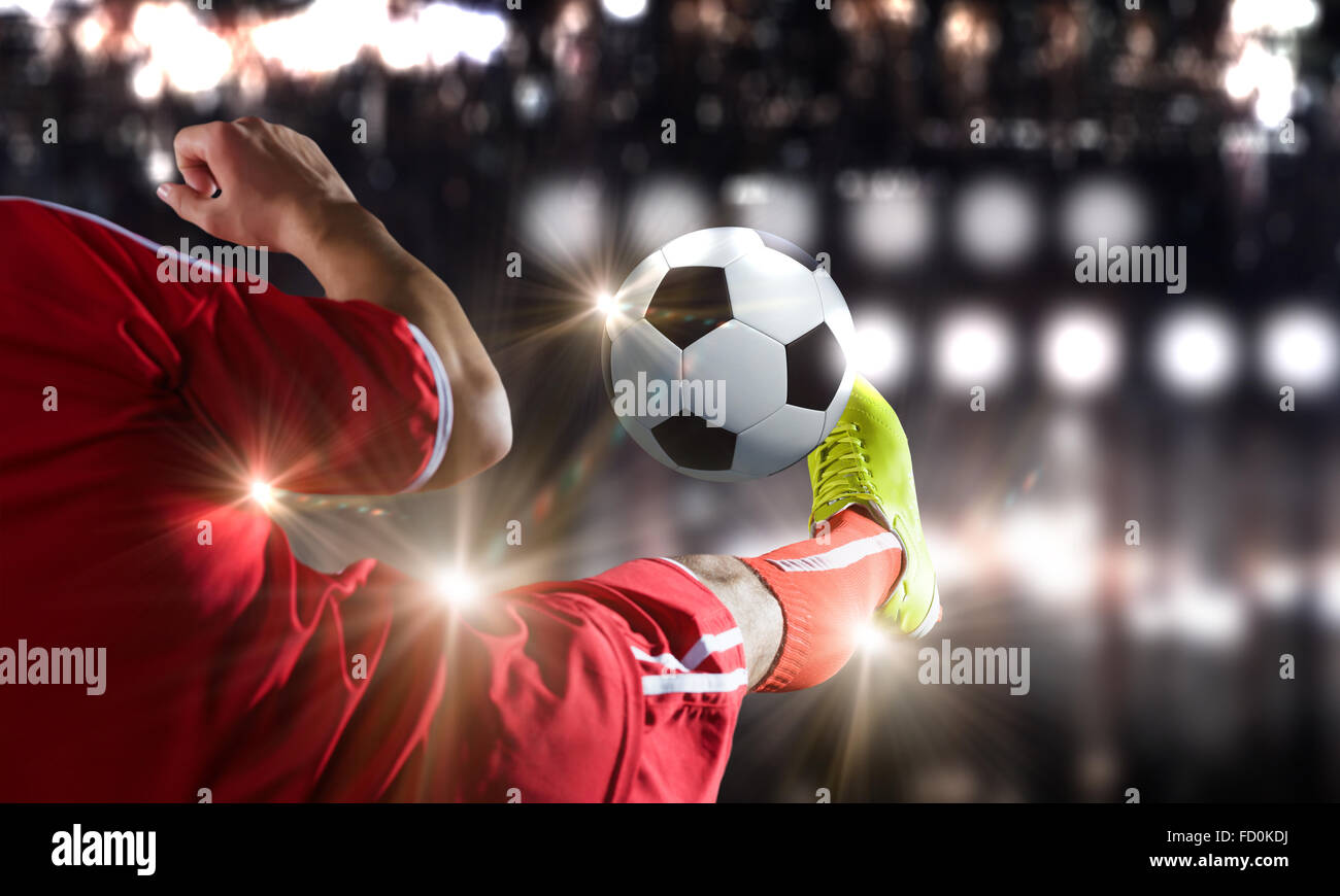 Close up image of footballer foot kicking the ball Stock Photo - Alamy