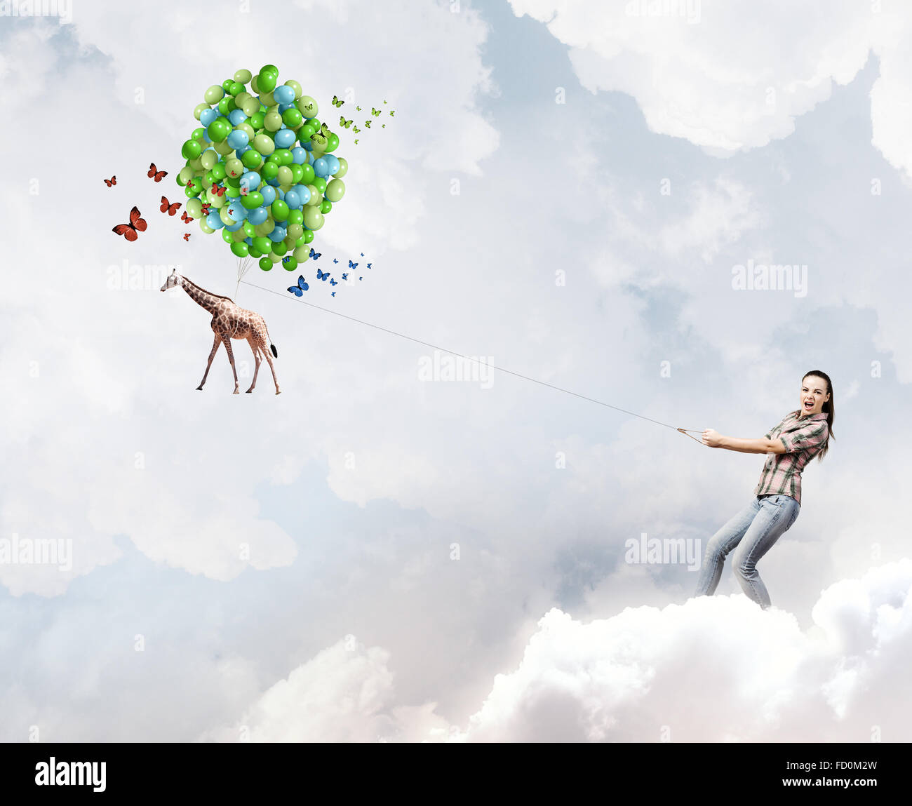 Young woman in casual and giraffe flying in sky Stock Photo - Alamy
